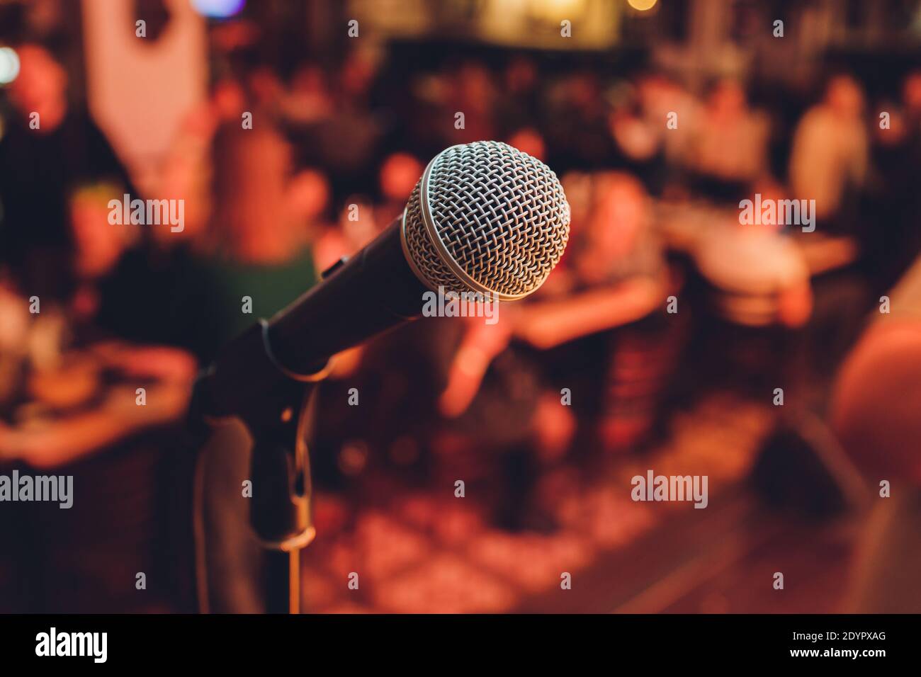 Retro microphone on stage in a pub or American Bar restaurant during a ...