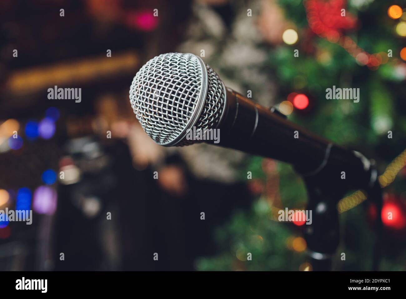 Retro microphone on stage in a pub or American Bar restaurant during a ...