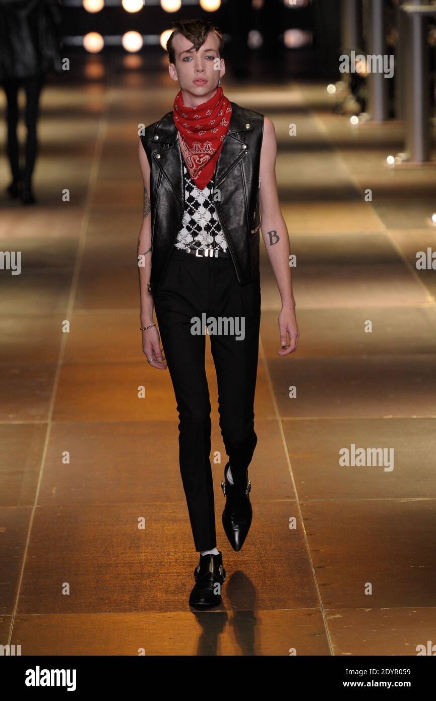 A model displays a creation as part of Yves Saint-Laurent Men Spring ...