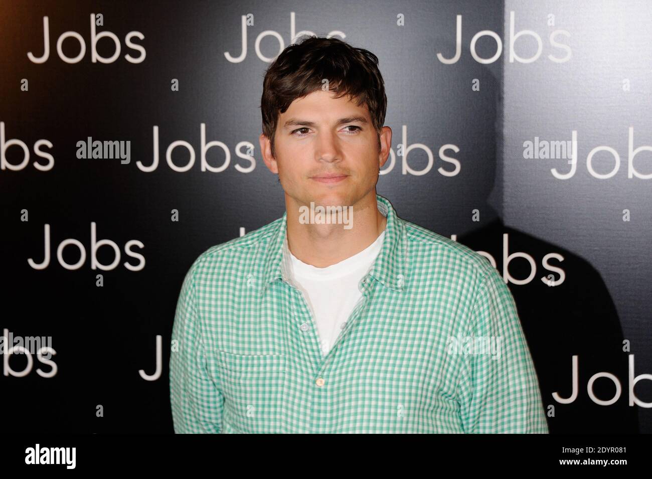 Ashton Kutcher posing at Job photocall in Park Hyatt hotel in Paris ...