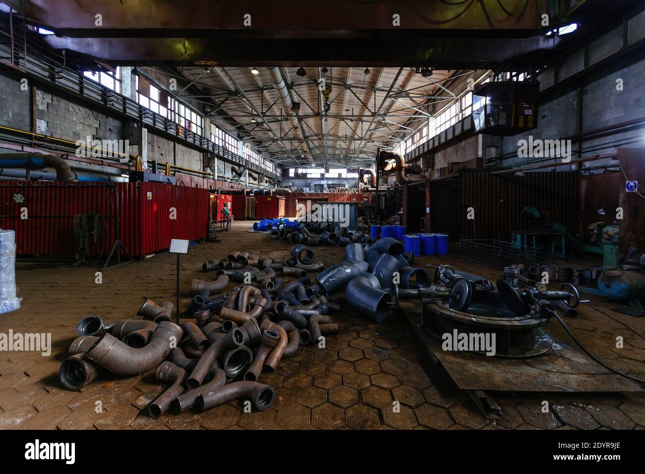 Cast metal blue pipe connection parts at workshop Stock Photo - Alamy