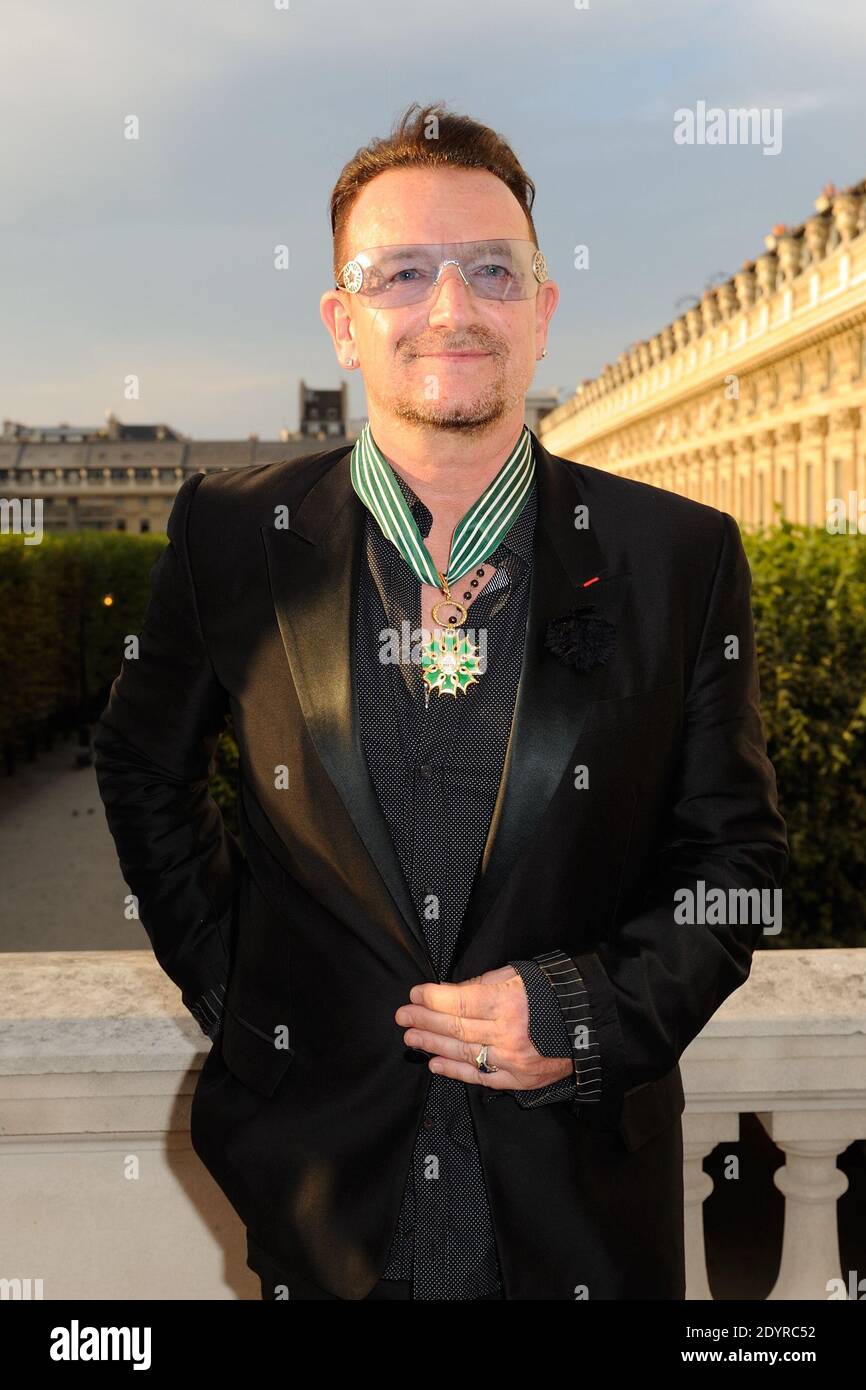 Bono poses for photos after being made 'Commandeur de l'ordre des Arts ...
