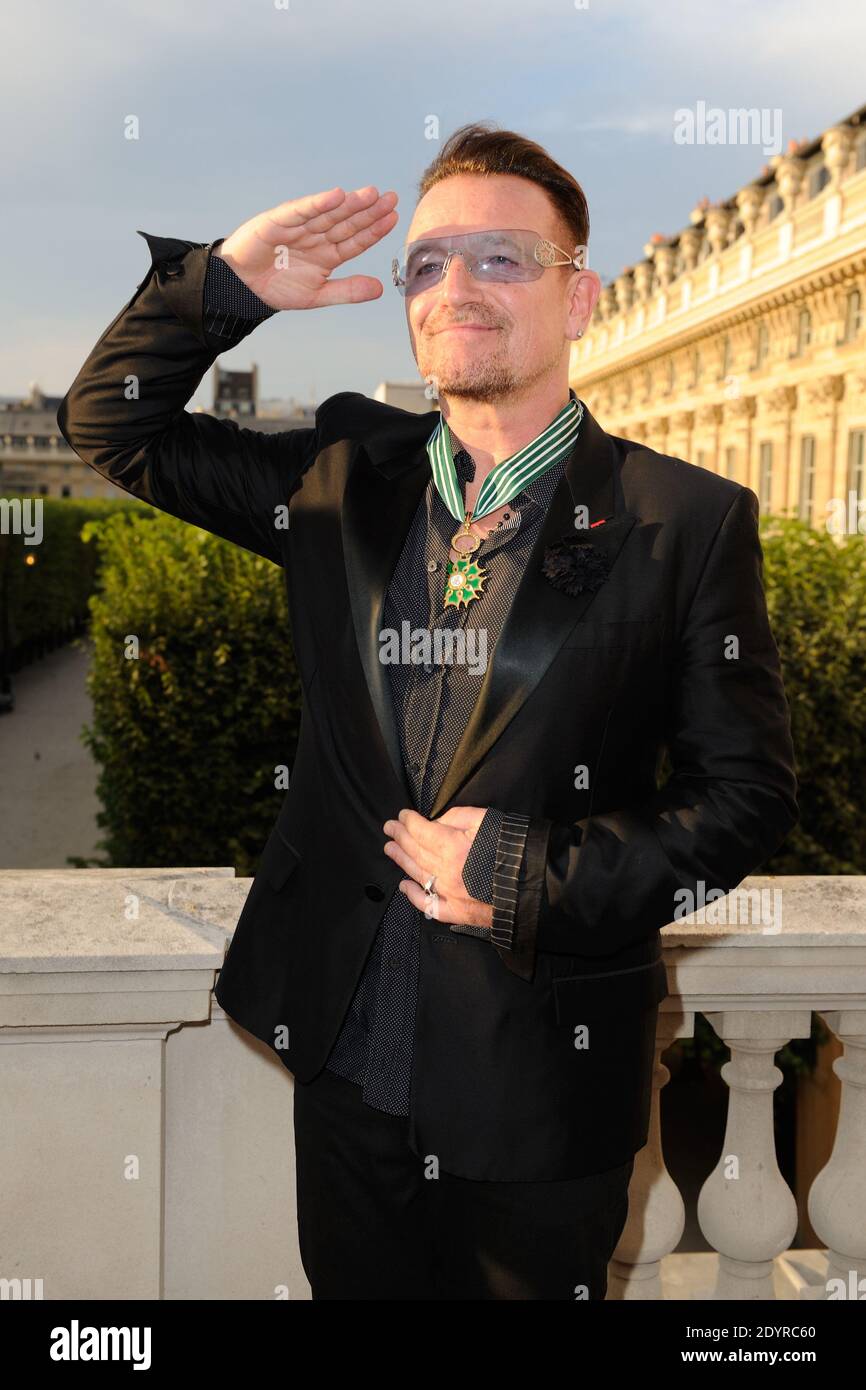 Bono poses for photos after being made 'Commandeur de l'ordre des Arts ...
