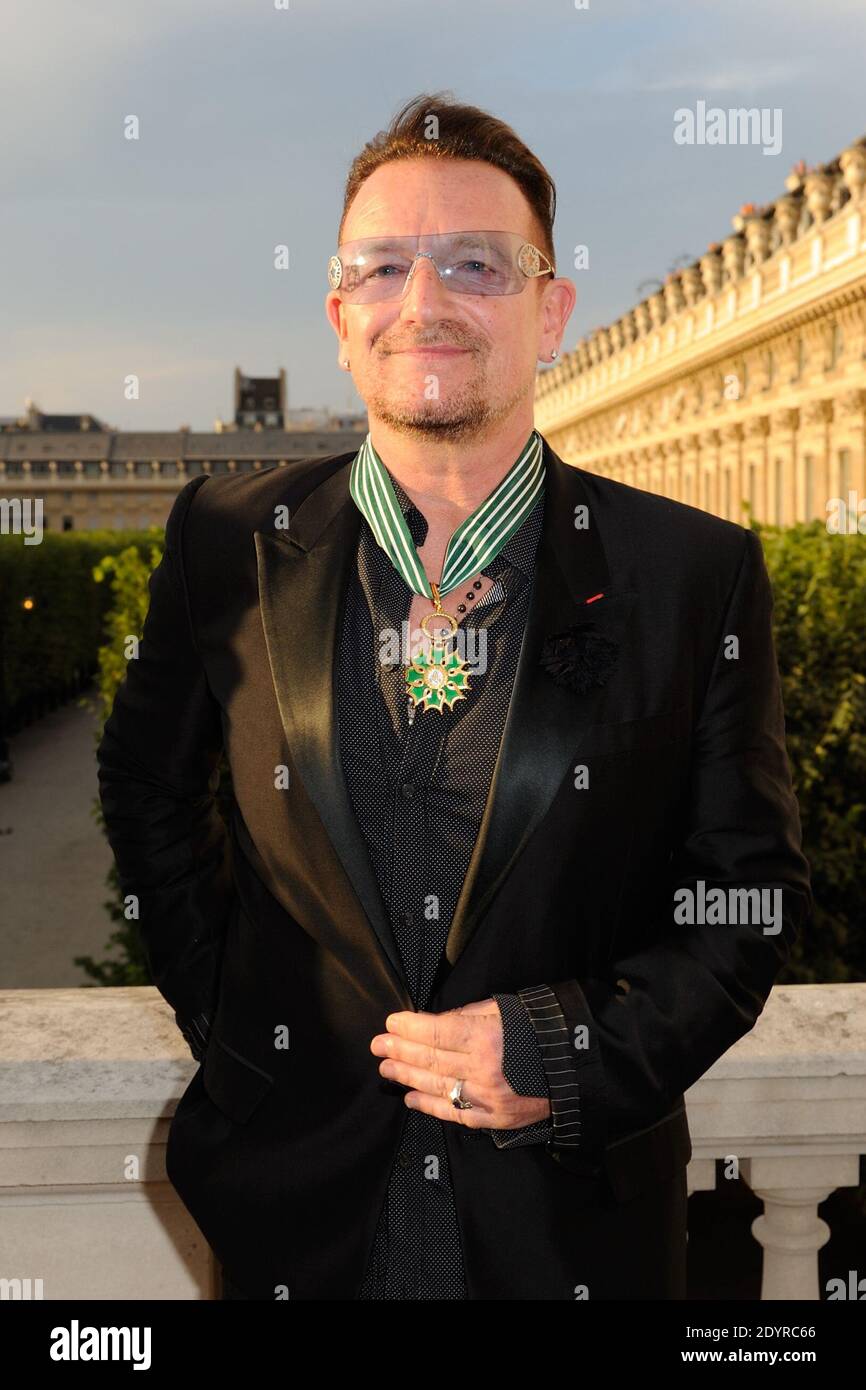 Bono poses for photos after being made 'Commandeur de l'ordre des Arts ...