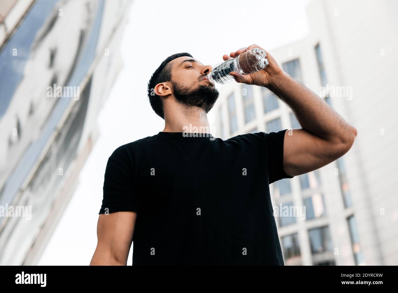 Young man jogging plastic bottle hi-res stock photography and images ...