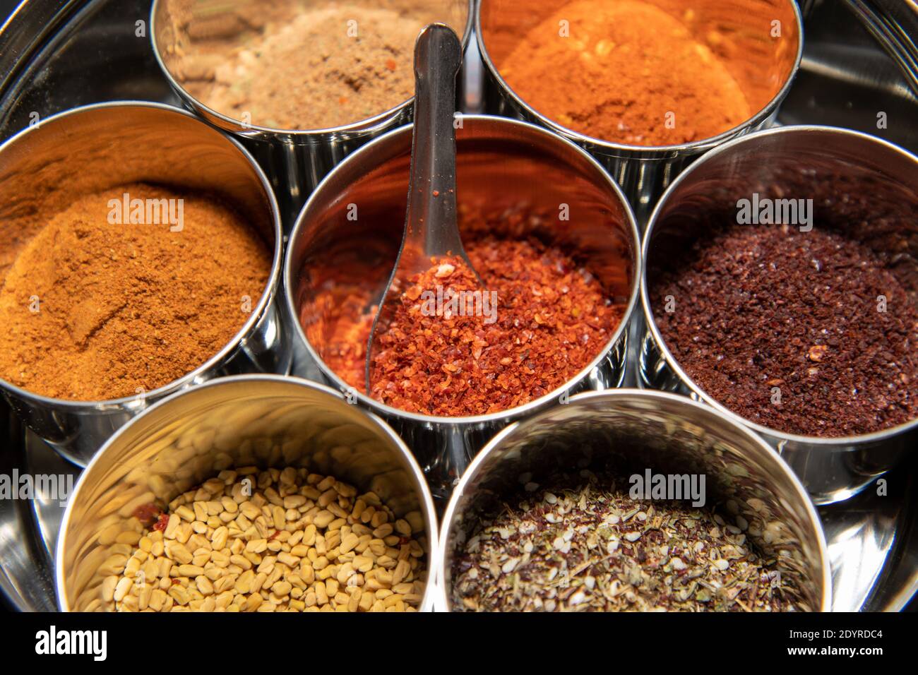 A selection of Indian spices in a metal tray Stock Photo - Alamy