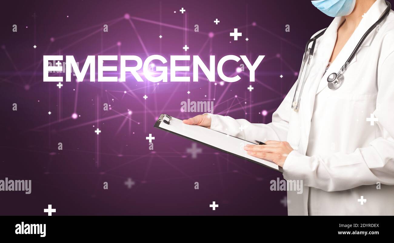 Doctor fills out medical record with EMERGENCY inscription, medical ...