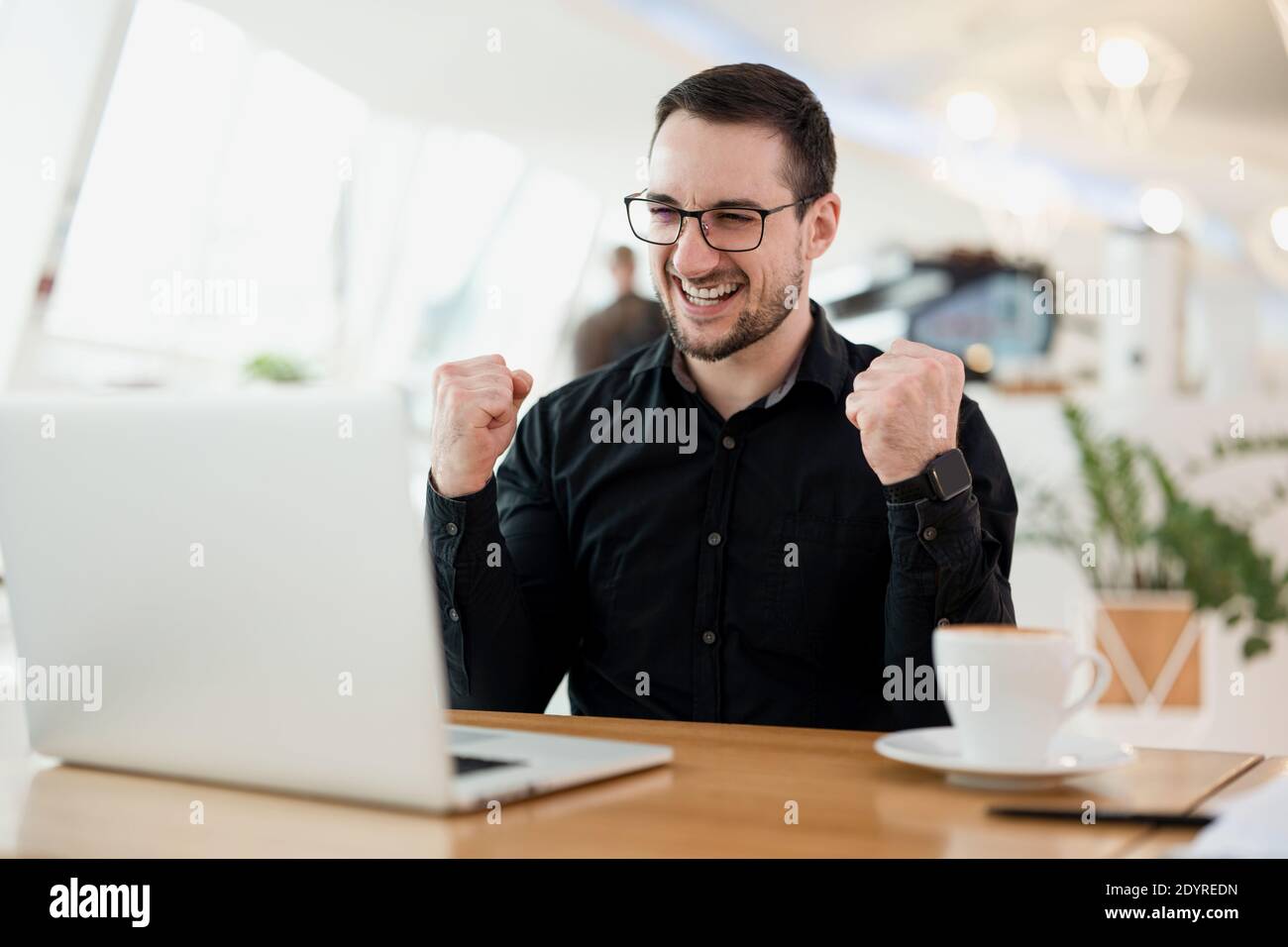 Yes, it's works Cheerful man in glasses is happy that the project on ...