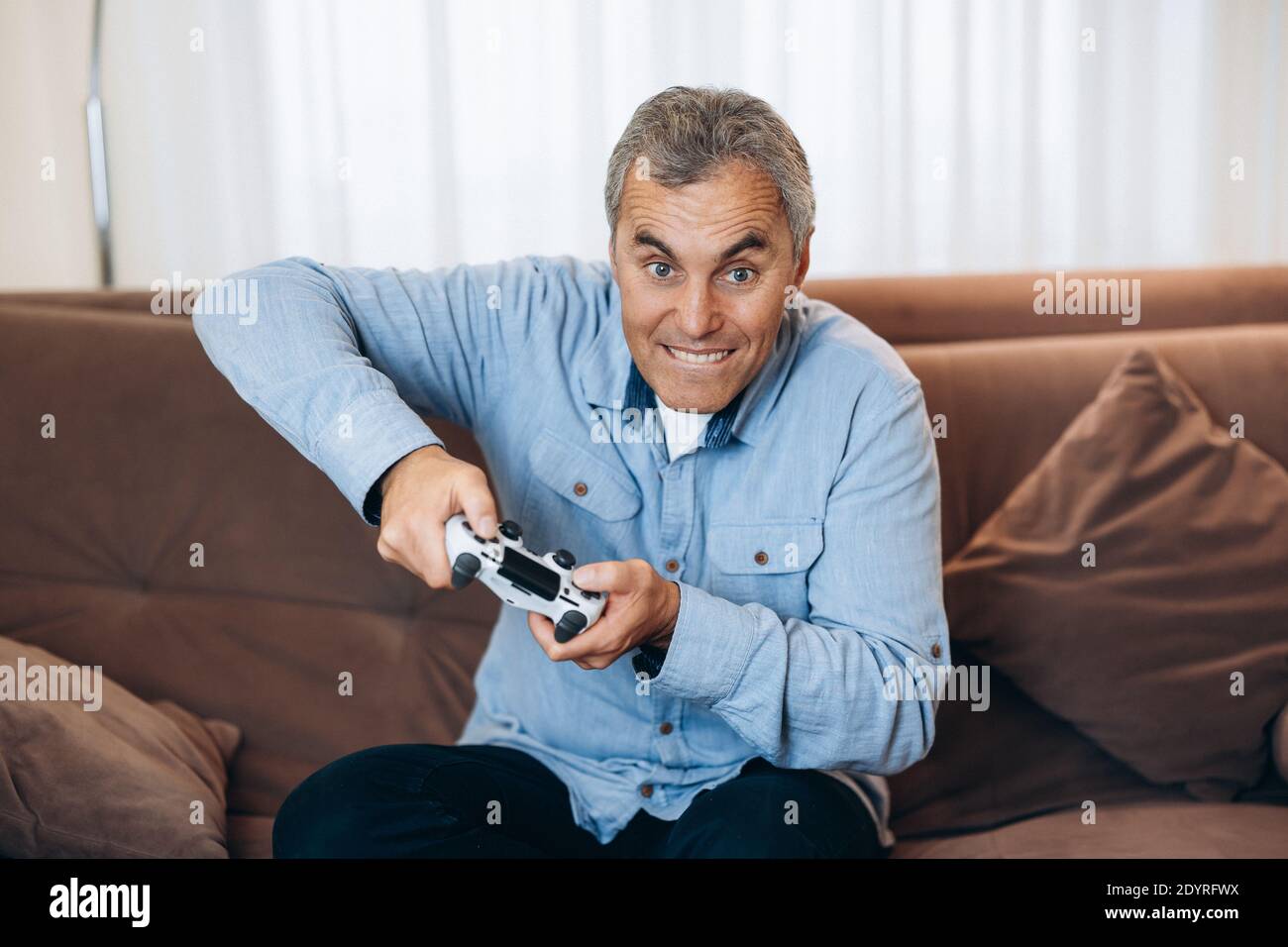 Person presses buttons on remote hi-res stock photography and images ...