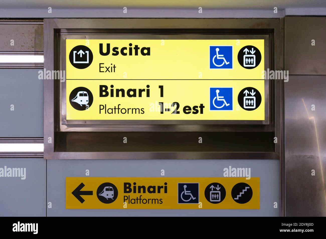 Closeup sign board shows direction to railway train station platform 1 ...