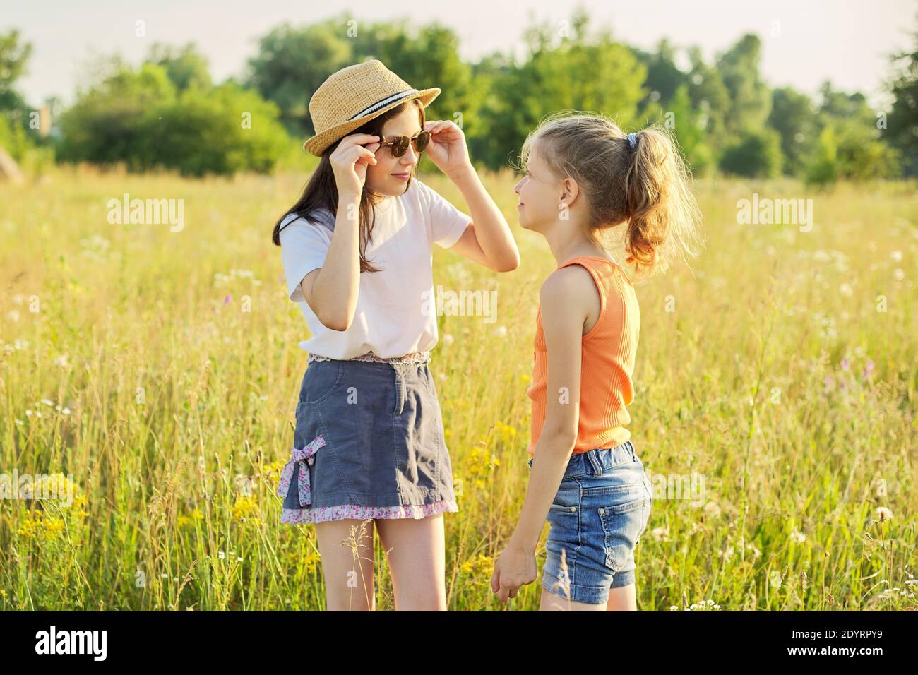 Children are having fun in nature, two girls laugh Stock Photo - Alamy