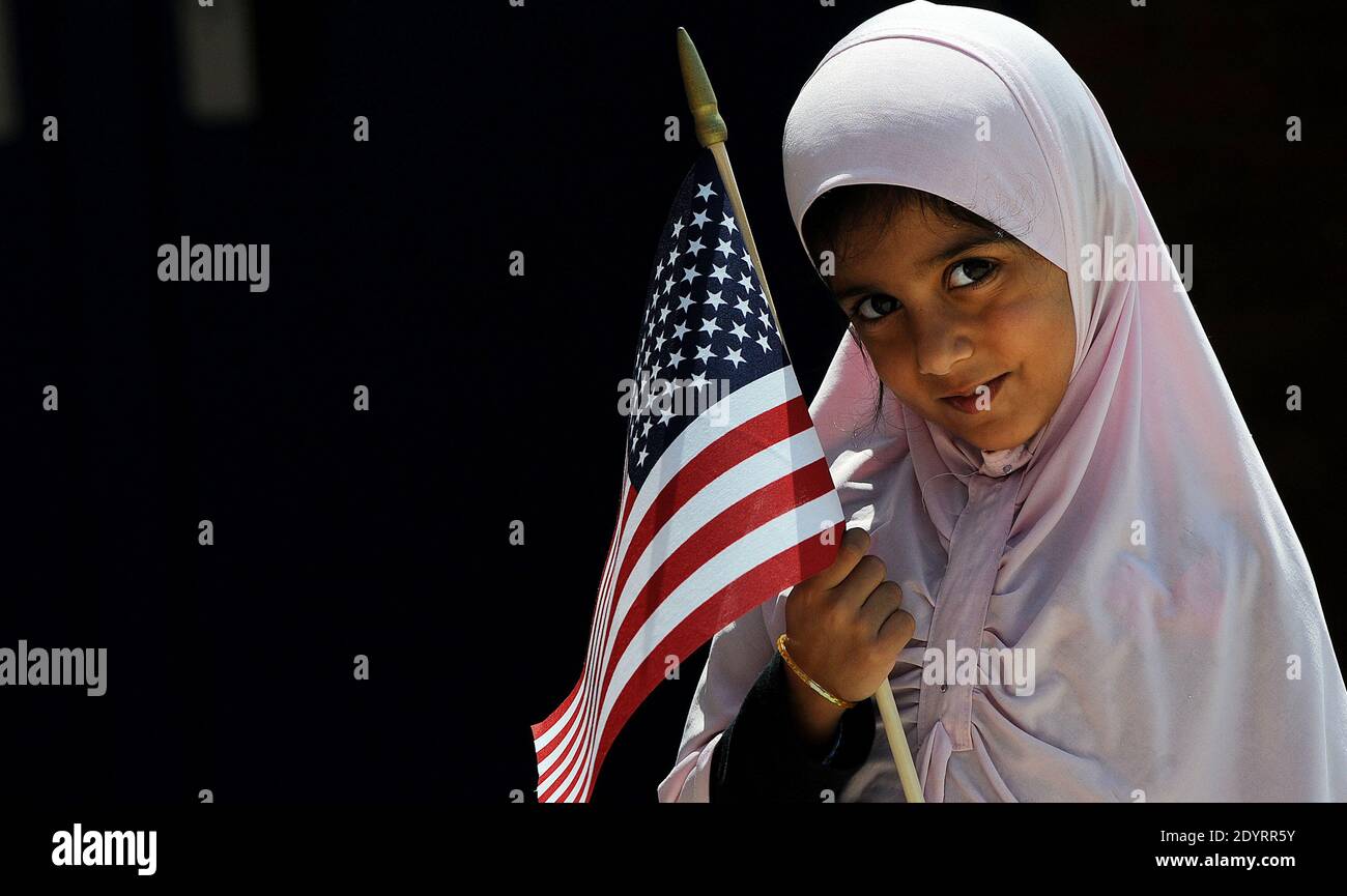 Fatima Zia holds an American flag given by his father who was one of ...