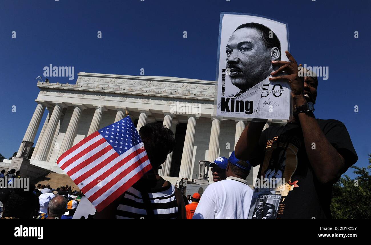 People listen to speakers during the 50th anniversary of the March on ...
