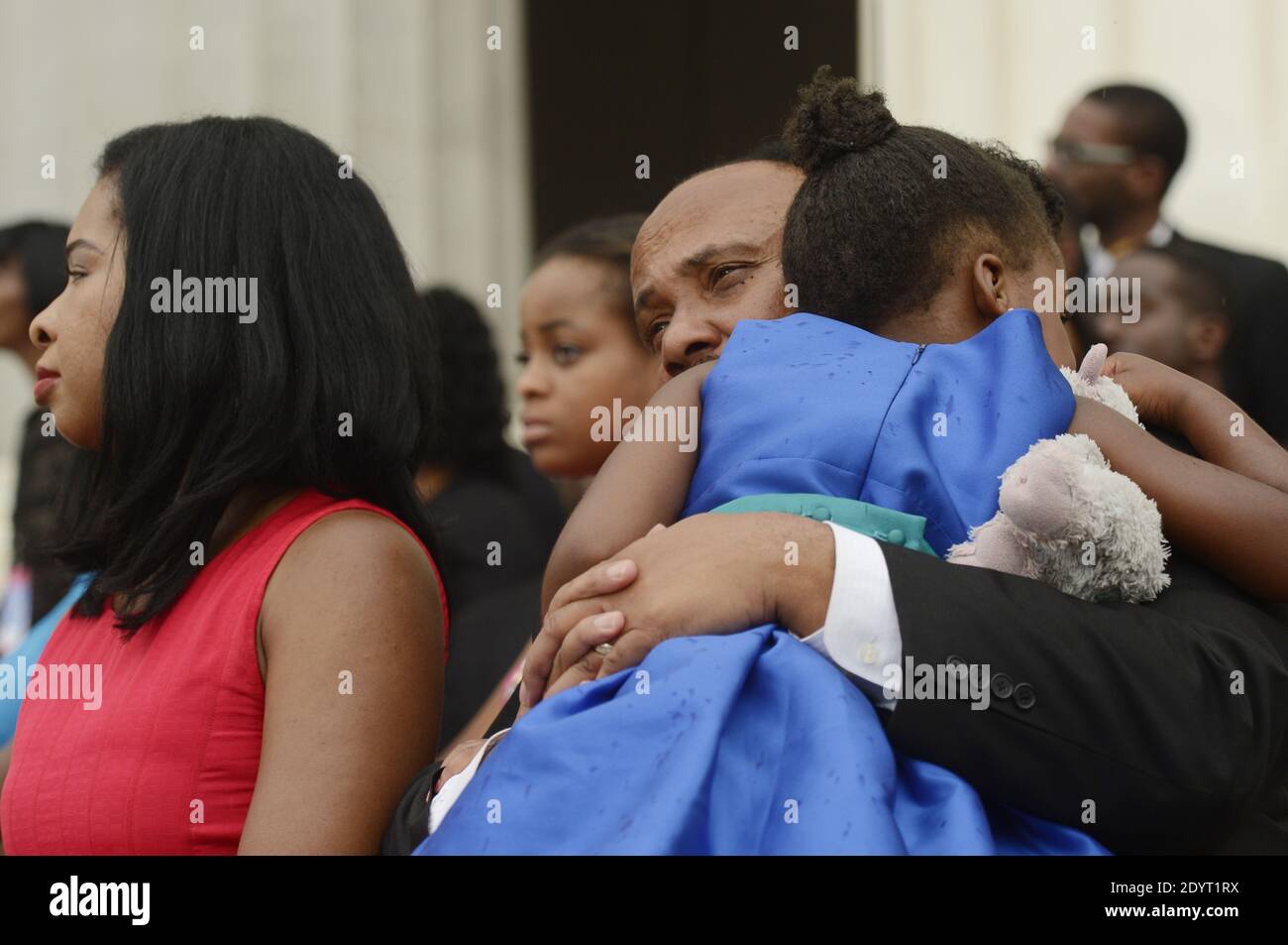 Martin Luther King III (C) holds his daughter Yolanda Renee King (R ...