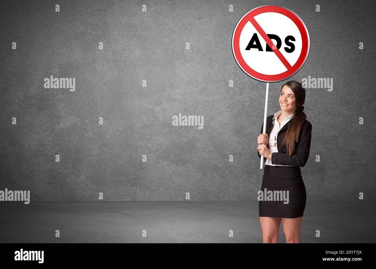 Young business person holdig traffic sign with ADS abbreviation ...