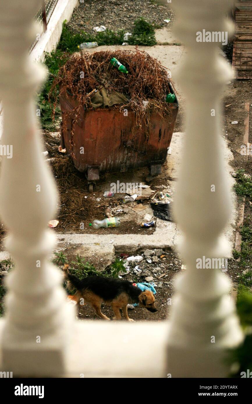 Overflowing trash container in Romania seen from a hotel's balcony ...