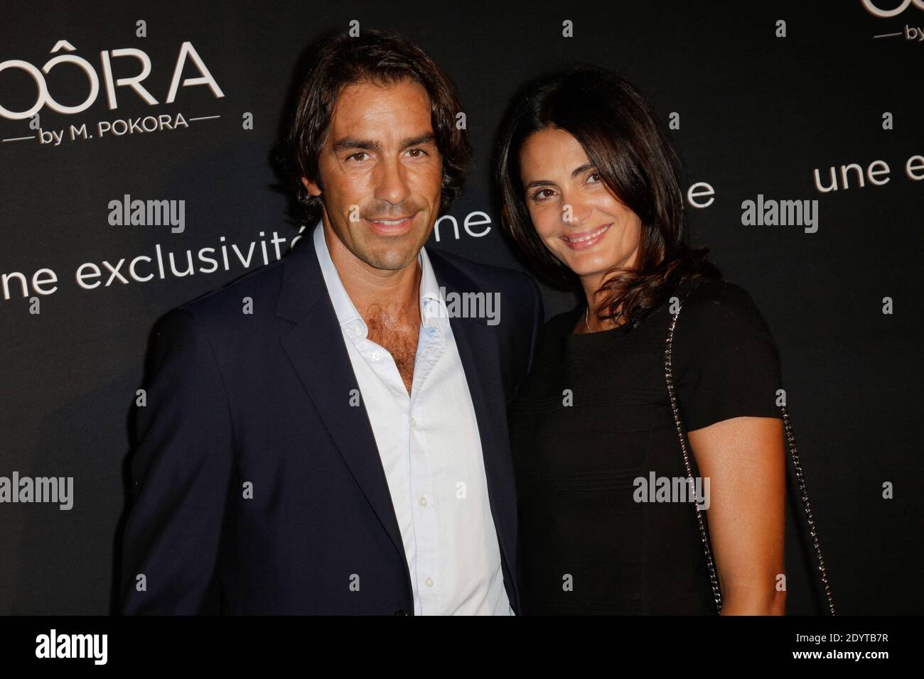 Robert Pires and his wife attending the Oora collection by M Pokora ...