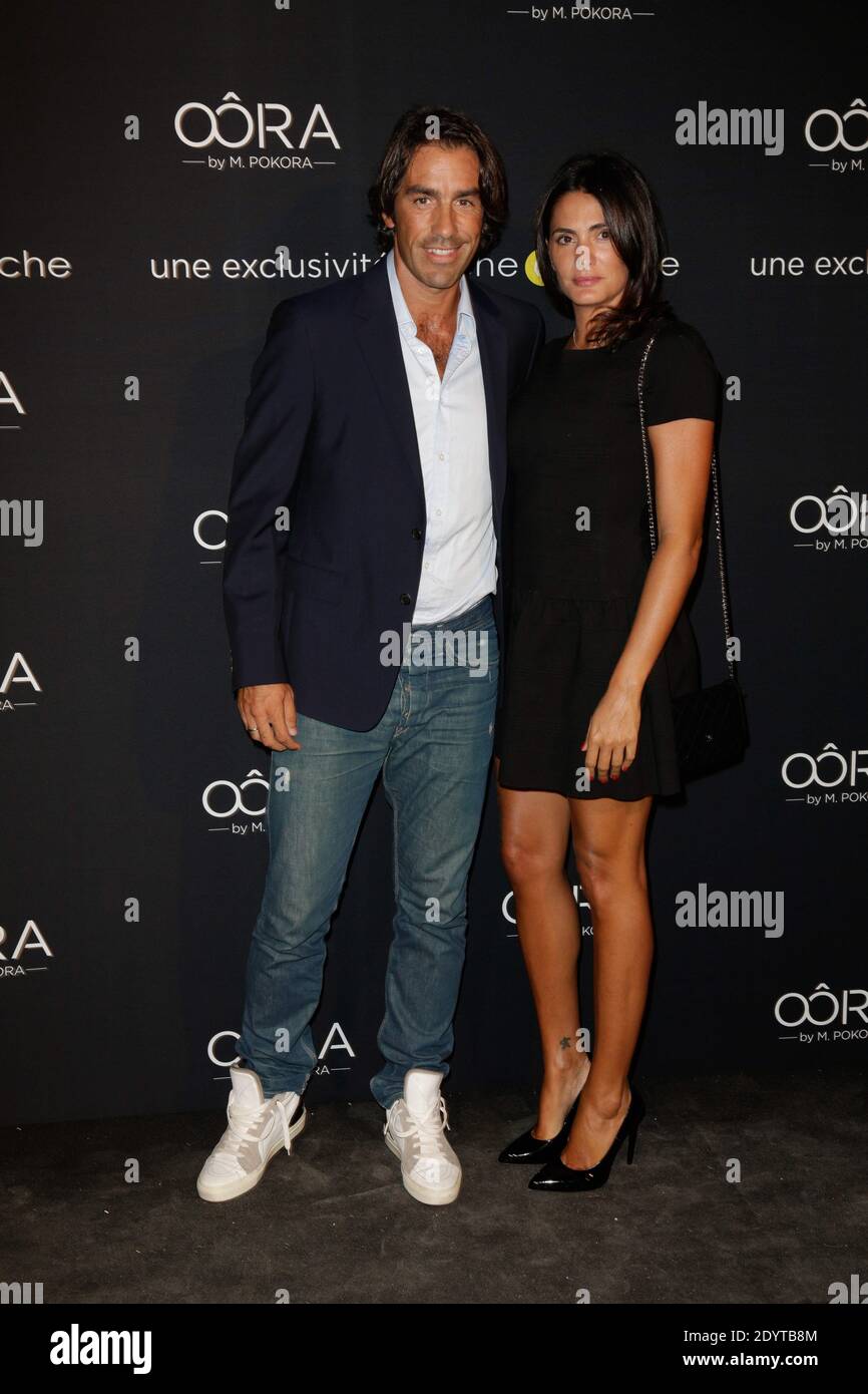 Robert Pires and his wife attending the Oora collection by M Pokora ...