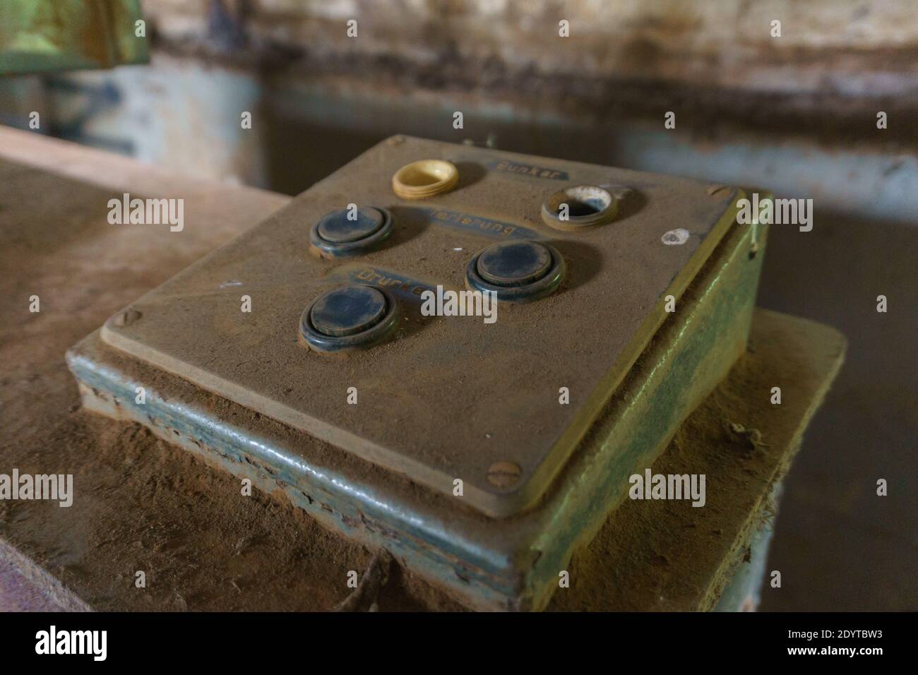 Industrial remote control panel with buttons covered in a layer of dust ...