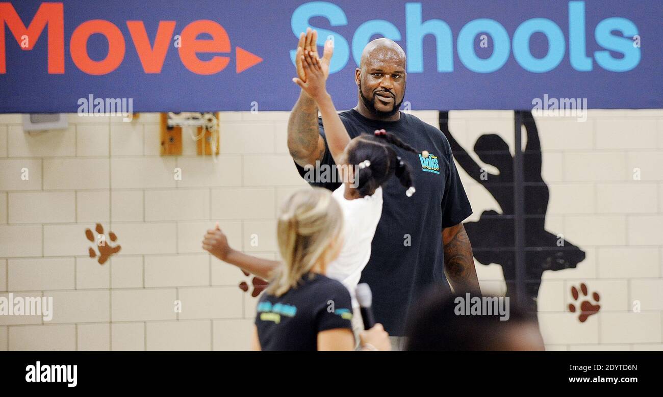 Shaquille O'Neal participates in a physical activity with children ...