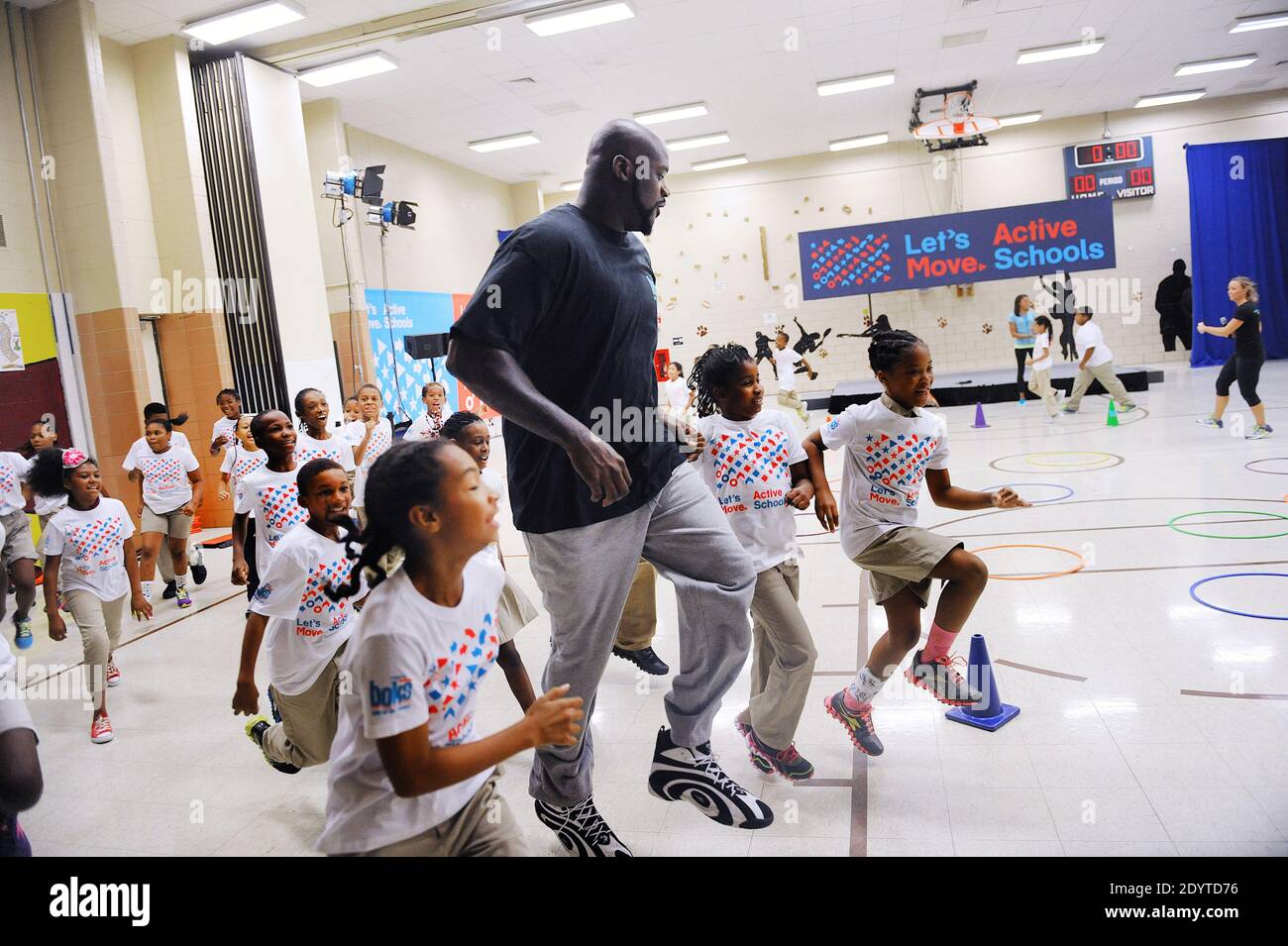 Shaquille O'Neal participates in a physical activity with children ...
