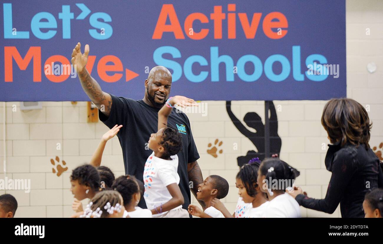 First Lady Michelle Obama and Shaquille O'Neal participate in a ...