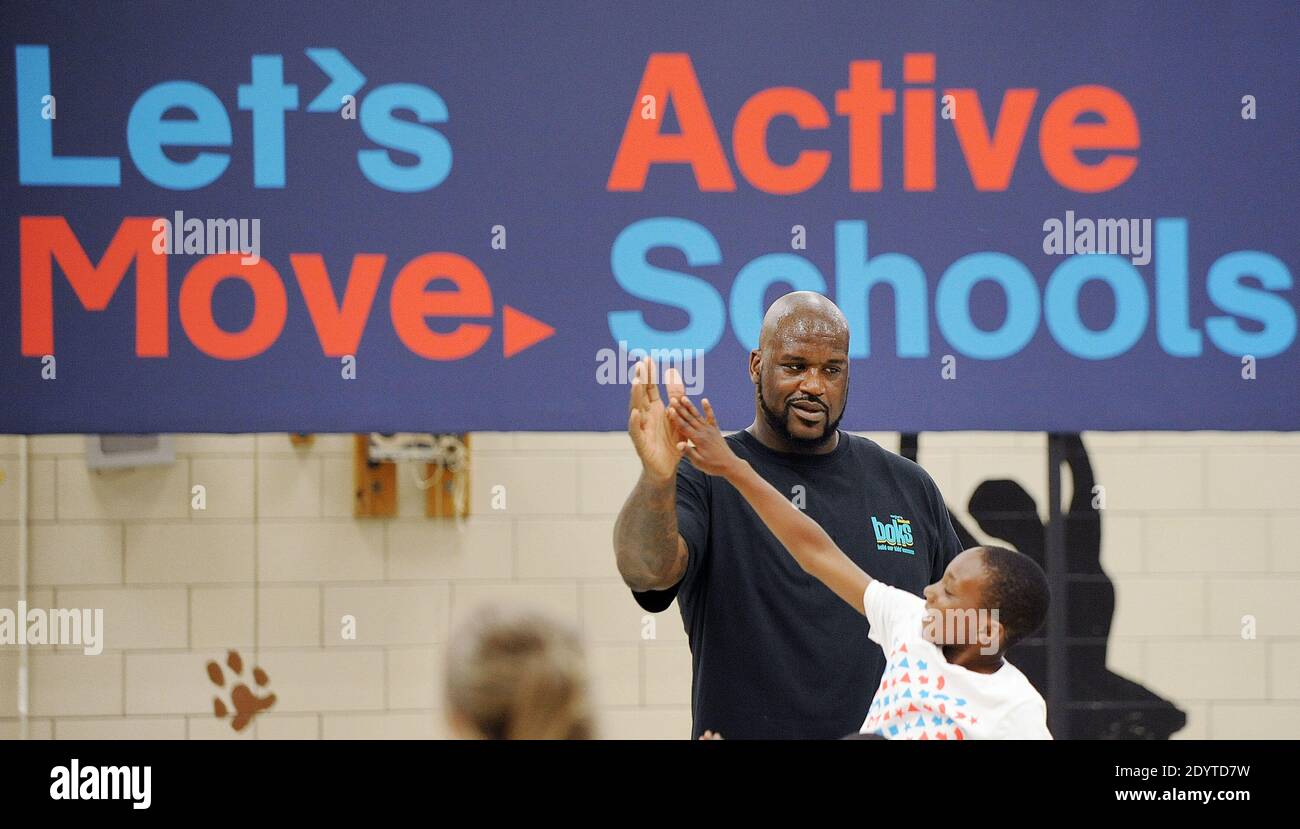 Shaquille O'Neal participates in a physical activity with children ...