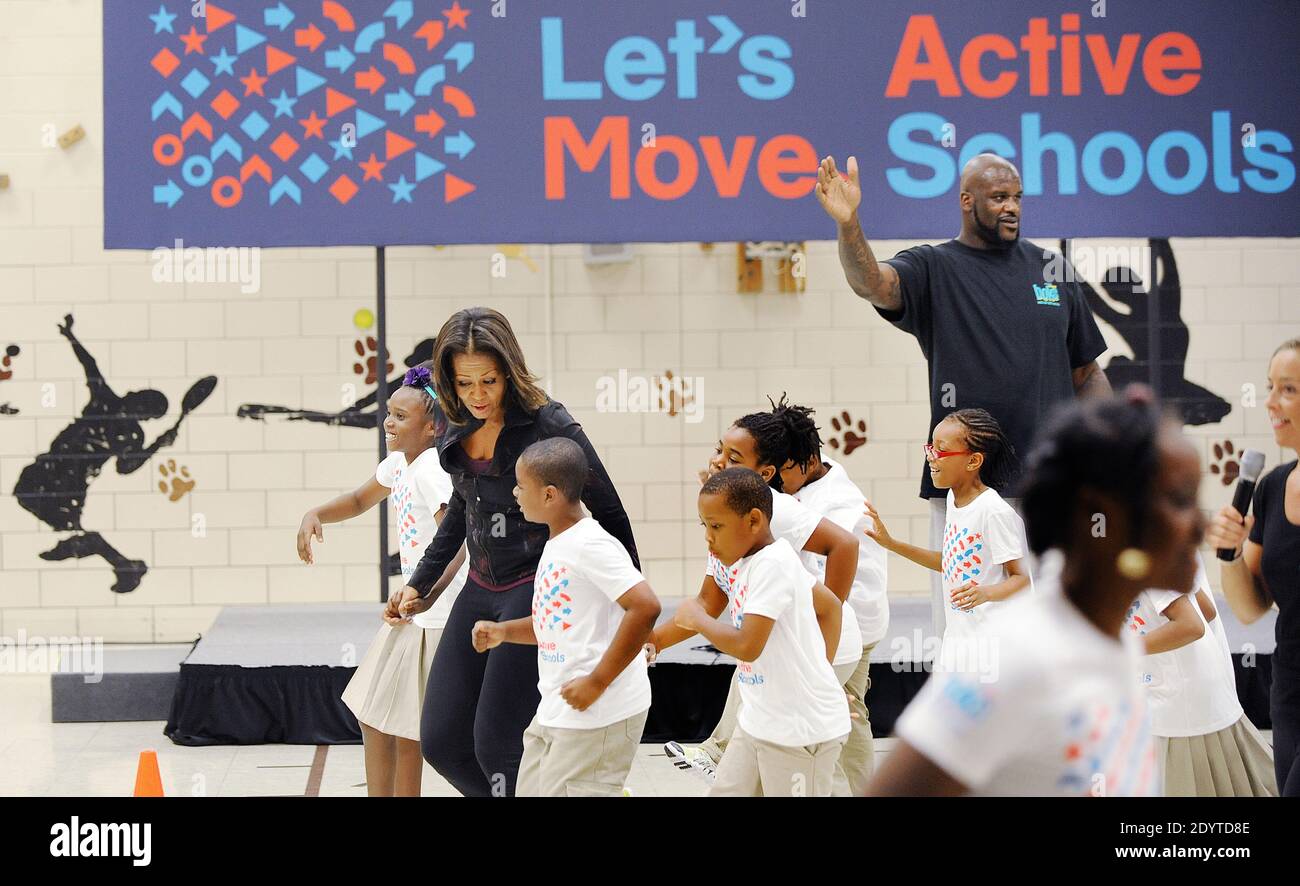 First Lady Michelle Obama and Shaquille O'Neal participate in a ...