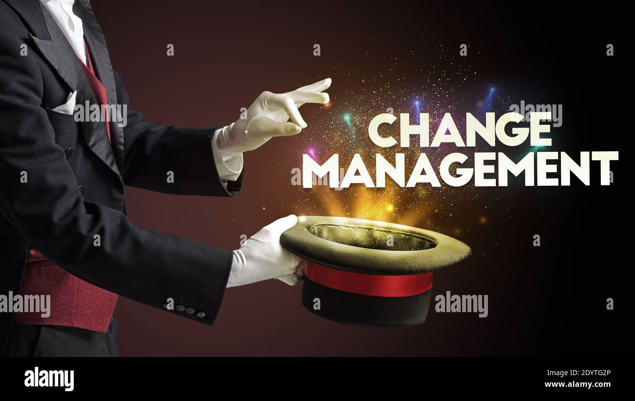 Illusionist is showing magic trick with CHANGE MANAGEMENT inscription ...