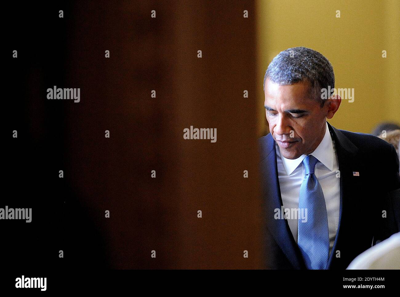 President Barack Obama looks down at the end of a meeting with Senators ...
