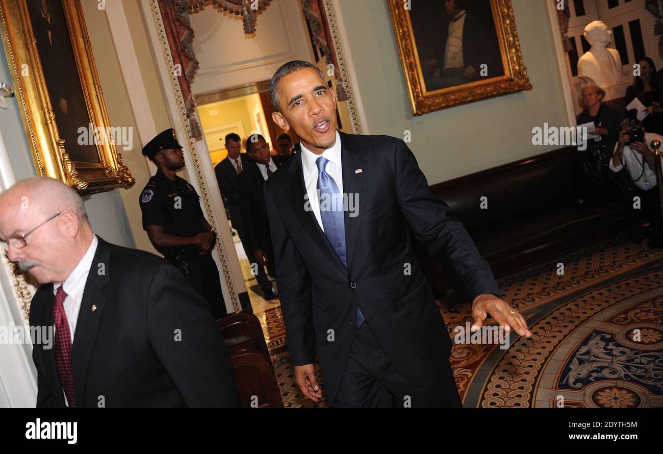 President Barack Obama waves as he arrives at the Capitol to meet with ...