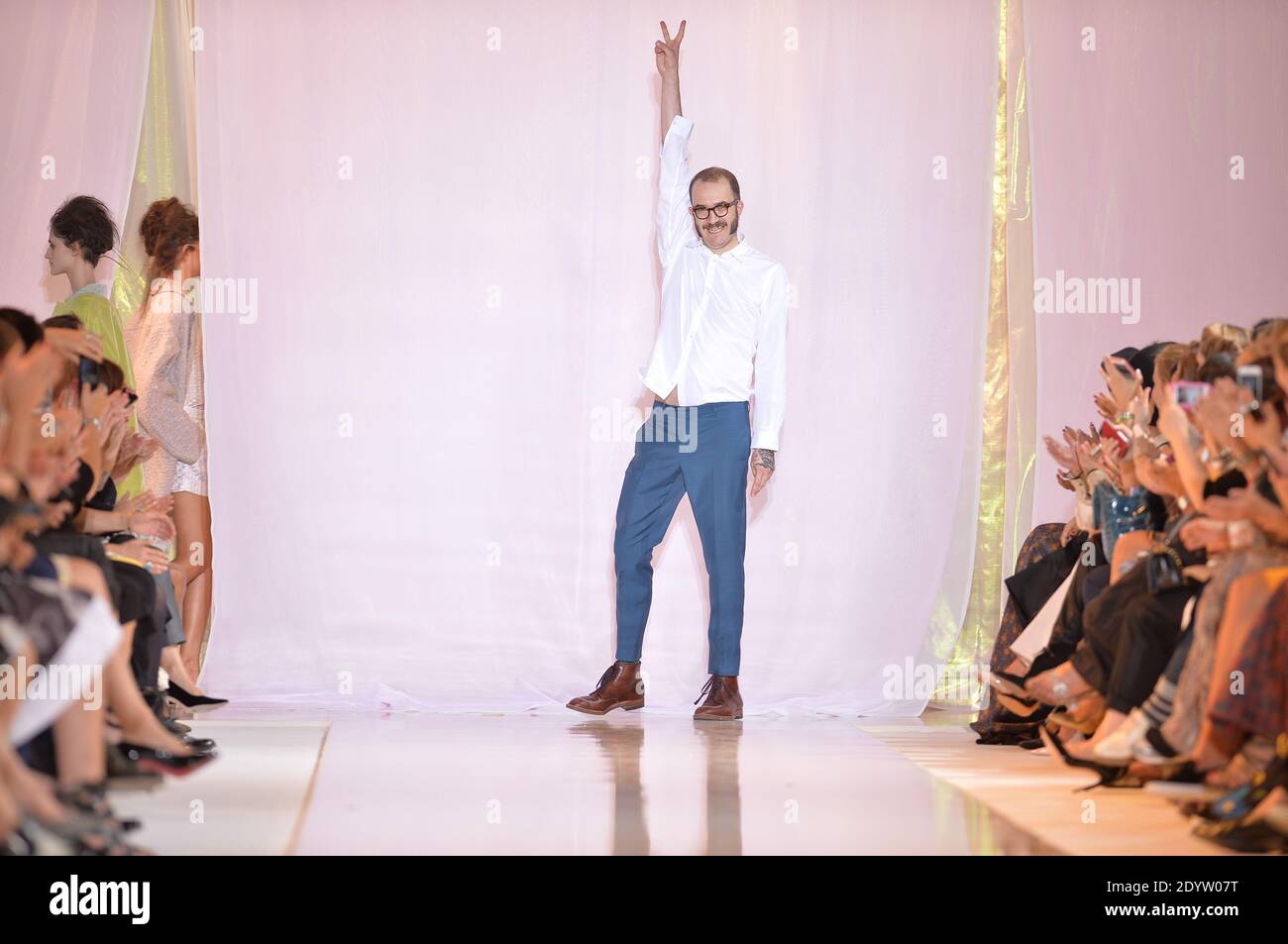 Designer Marco Zanini appears on the runway after his collection show ...