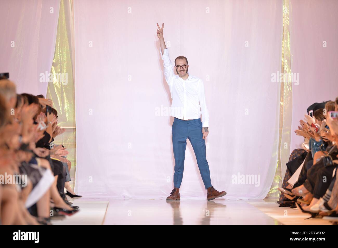 Designer Marco Zanini appears on the runway after his collection show ...