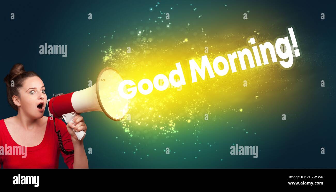 Young woman yelling to loudspeaker with Good Morning! inscription ...