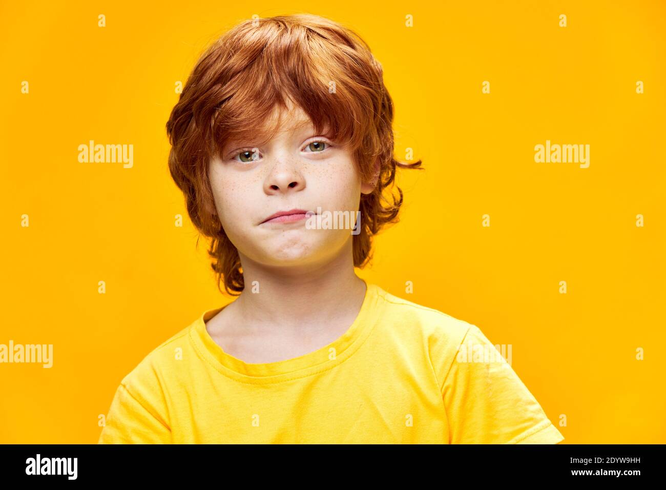 Redhead child face close up yellow t-shirt and fun childhood Stock ...