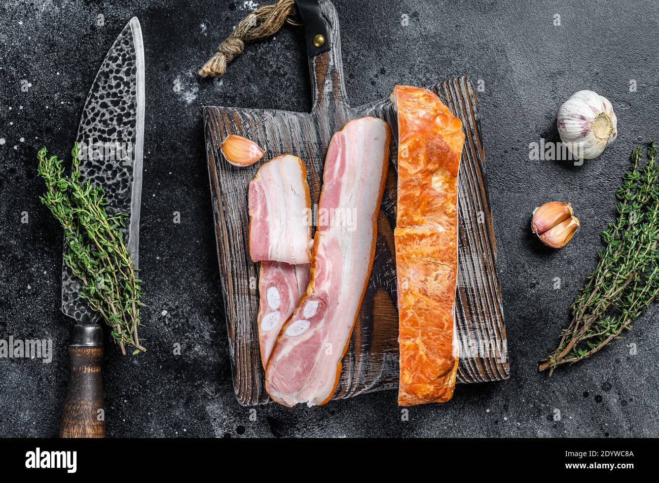 Smoked pork belly bacon block. Black background. Top view Stock Photo ...