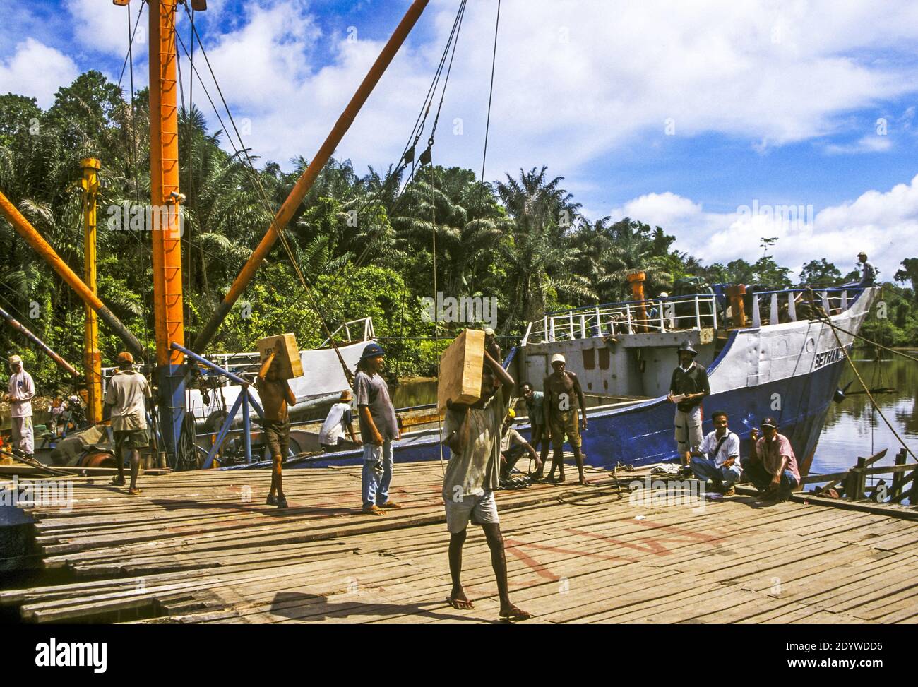 Papuan stevedores raise a sweat at the river port of Pomako, south of ...