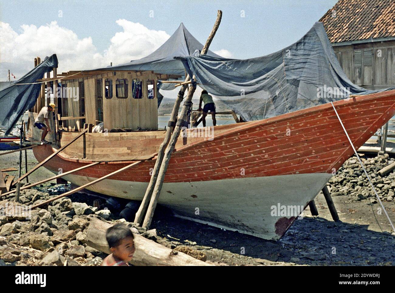 Buginese boat-builders at work on Sumbawa Island in West Nusa Tenggara ...