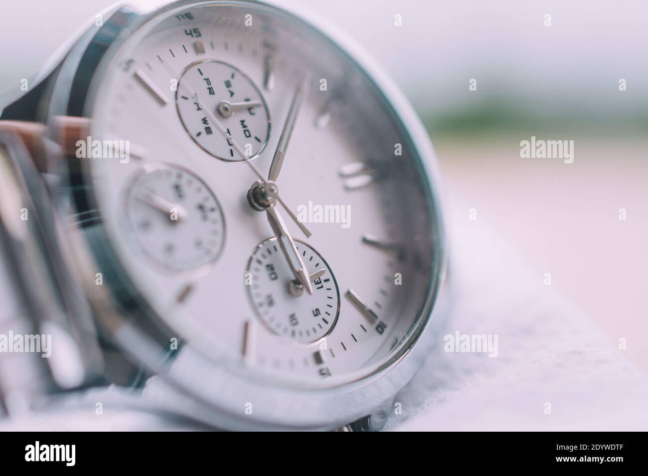 Watch Time Clock on wood table Stock Photo - Alamy