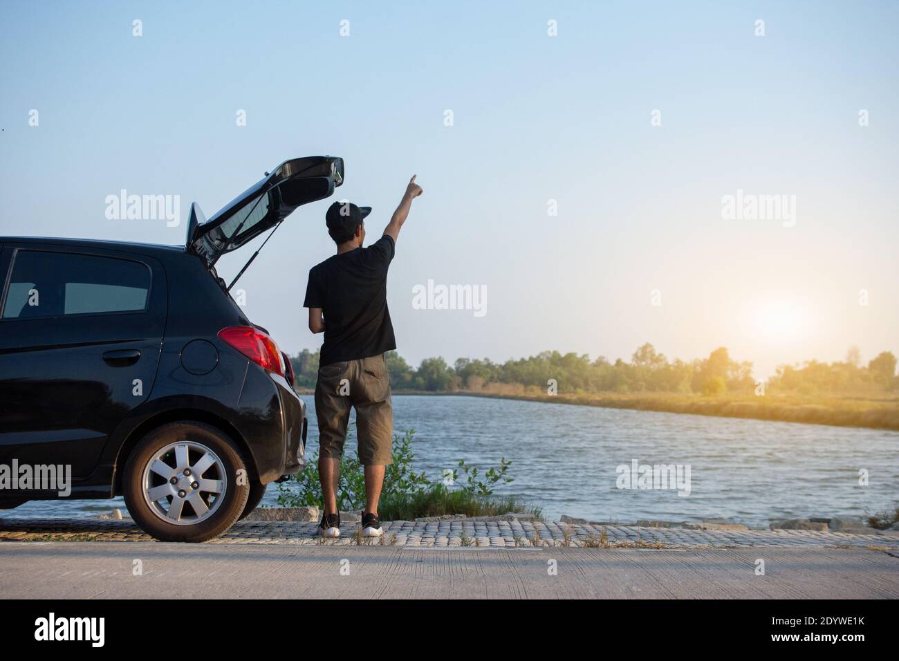People standing at Car parked on road Stock Photo - Alamy