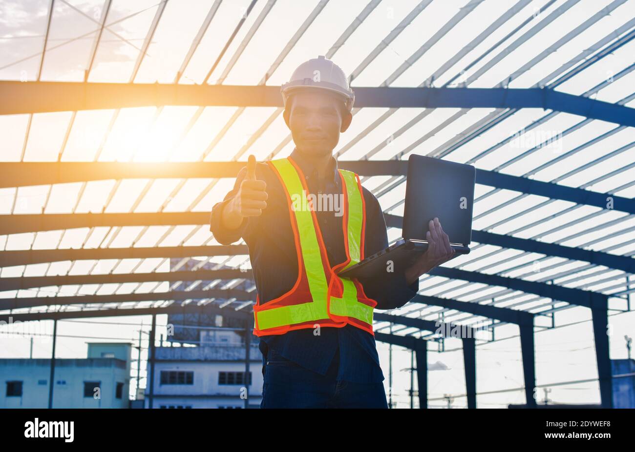 Engineer holding computer working on side technology Building ...