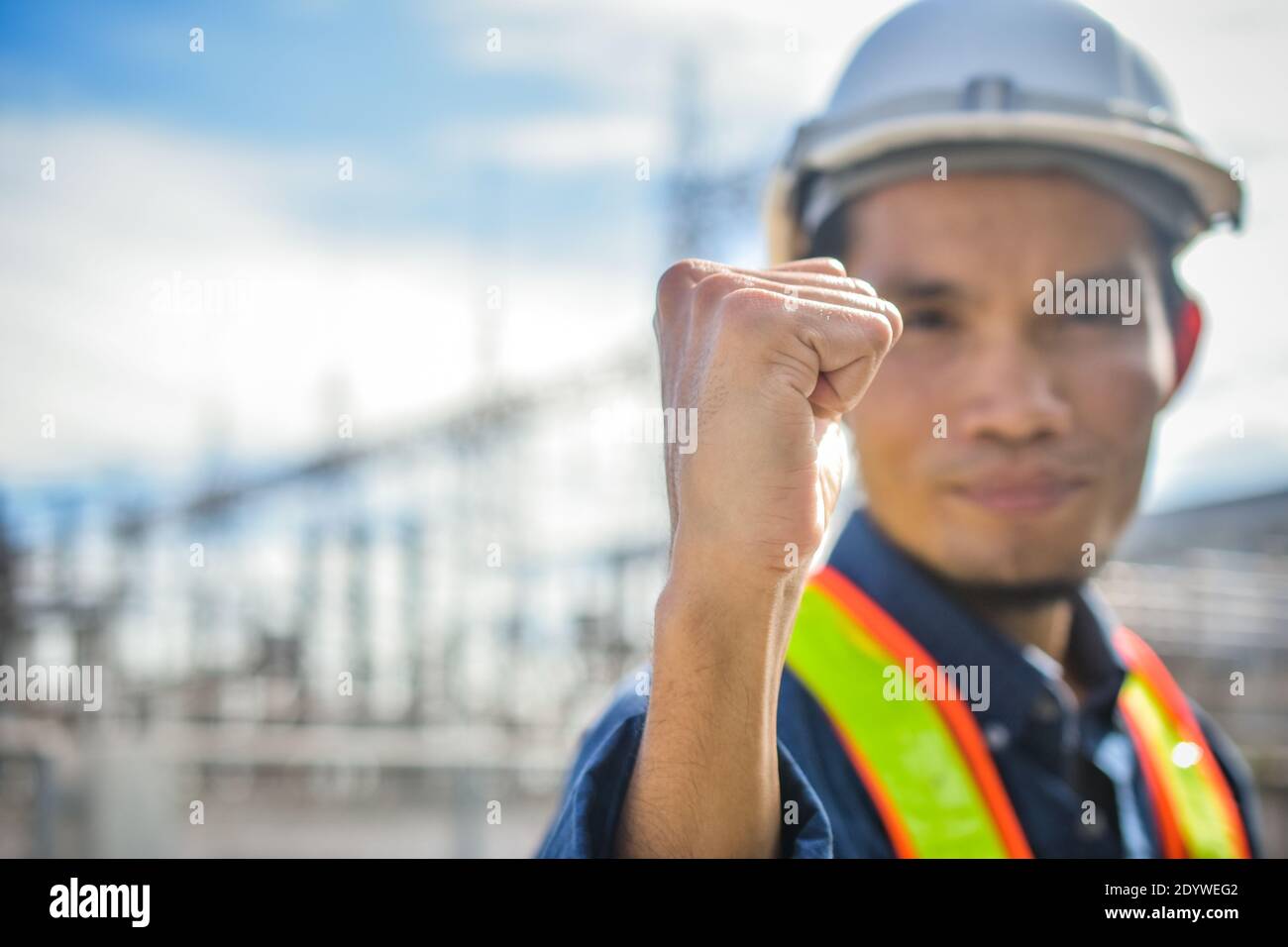 Engineer holding hand success at workplace Stock Photo - Alamy