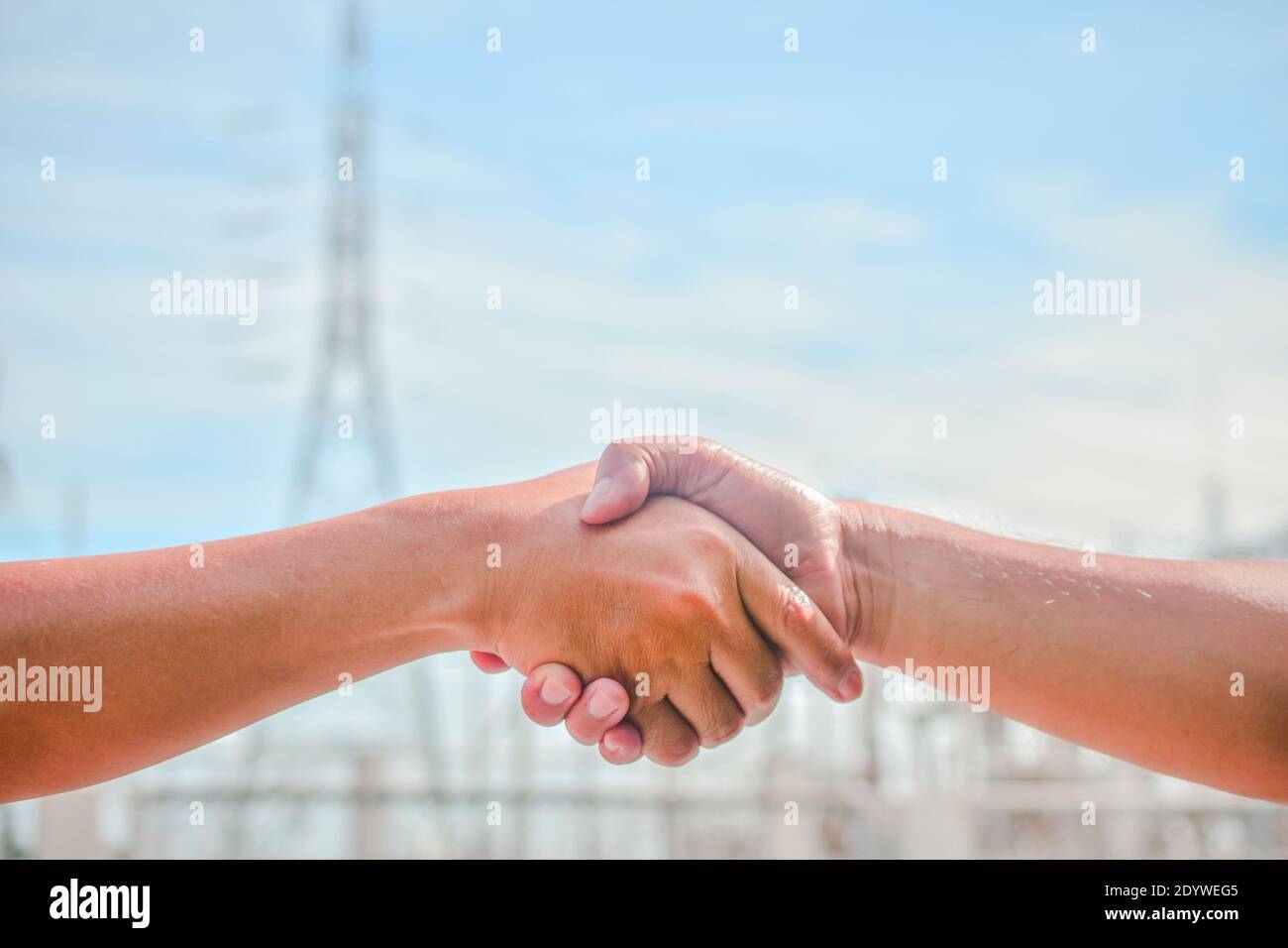 People shaking hands communicate the meaning of unity Business ...