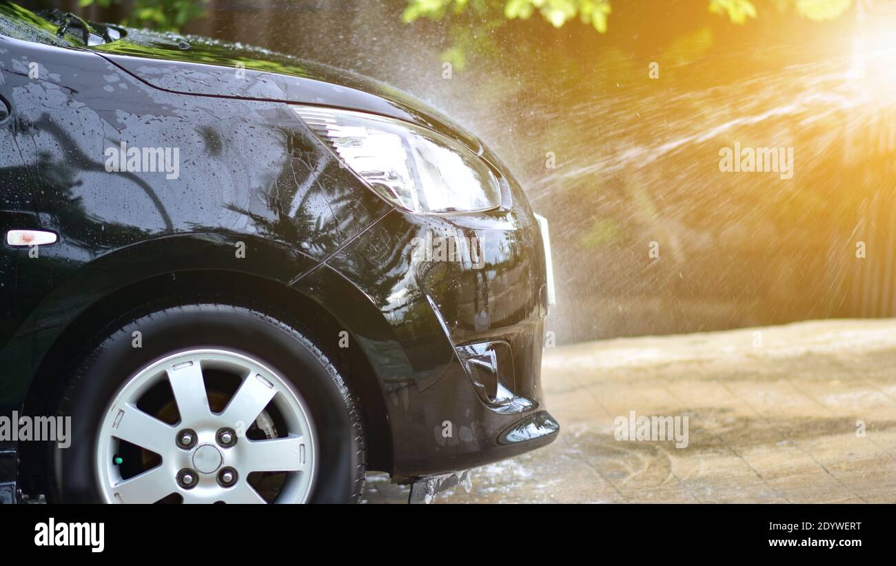 People cleaning car at home sunlight background Stock Photo - Alamy