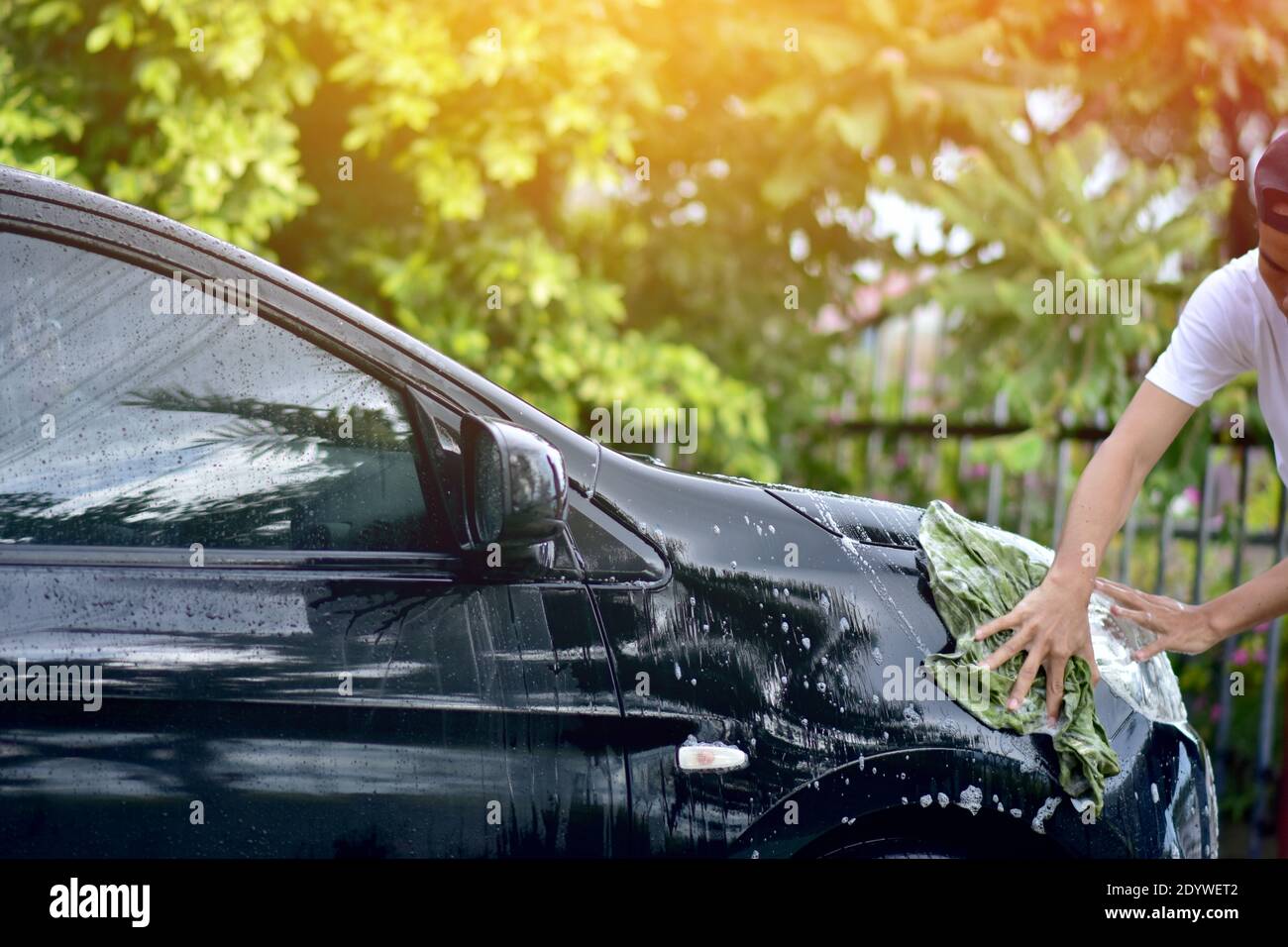 People cleaning car at home sunlight background Stock Photo - Alamy