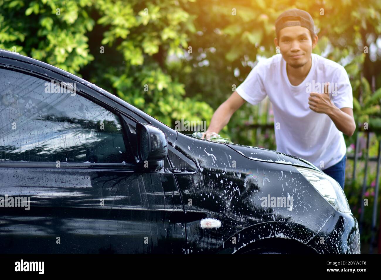 People cleaning car at home sunlight background Stock Photo - Alamy