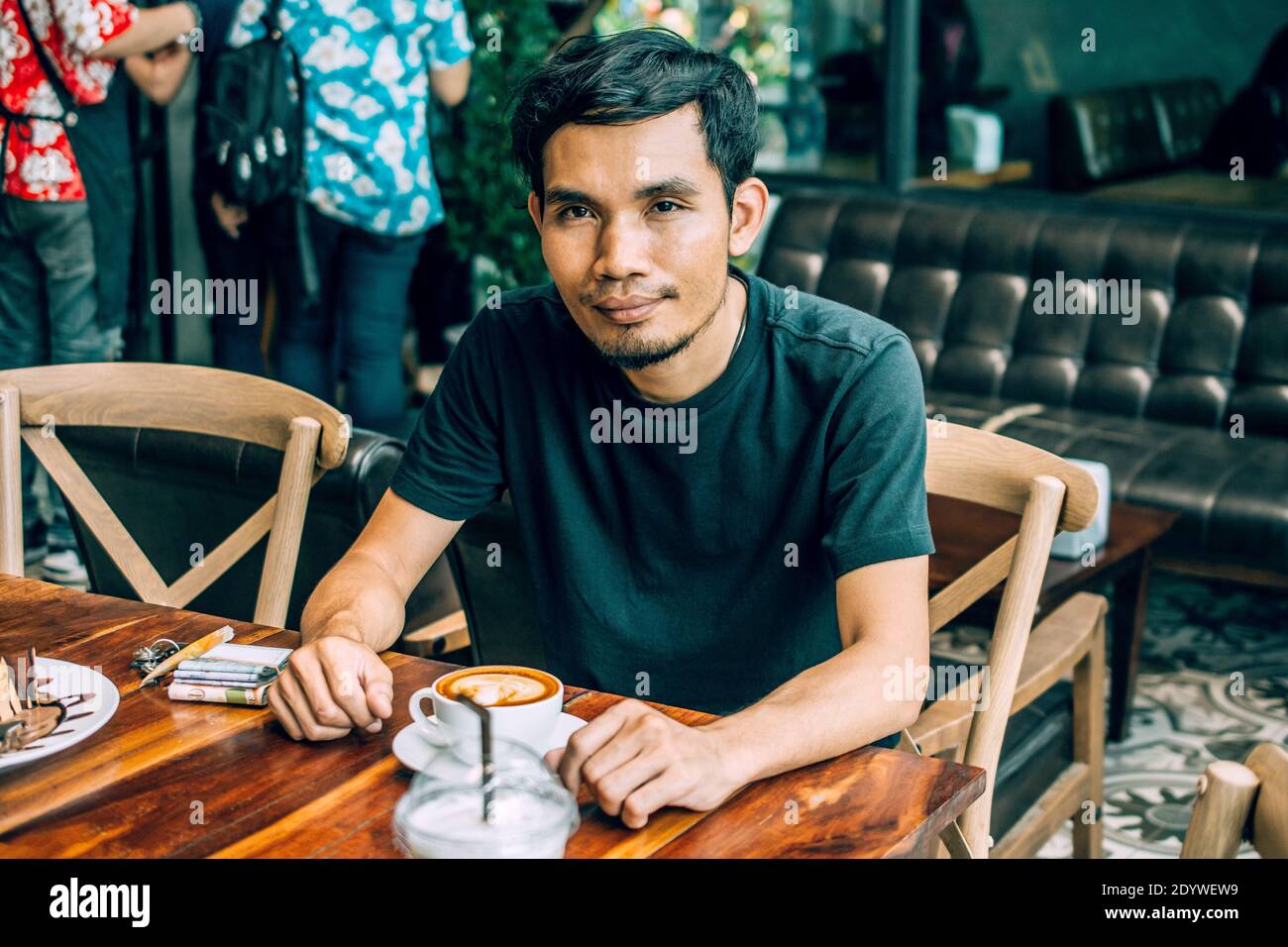 Man sitting in coffee shop for drink in coffee time Stock Photo - Alamy