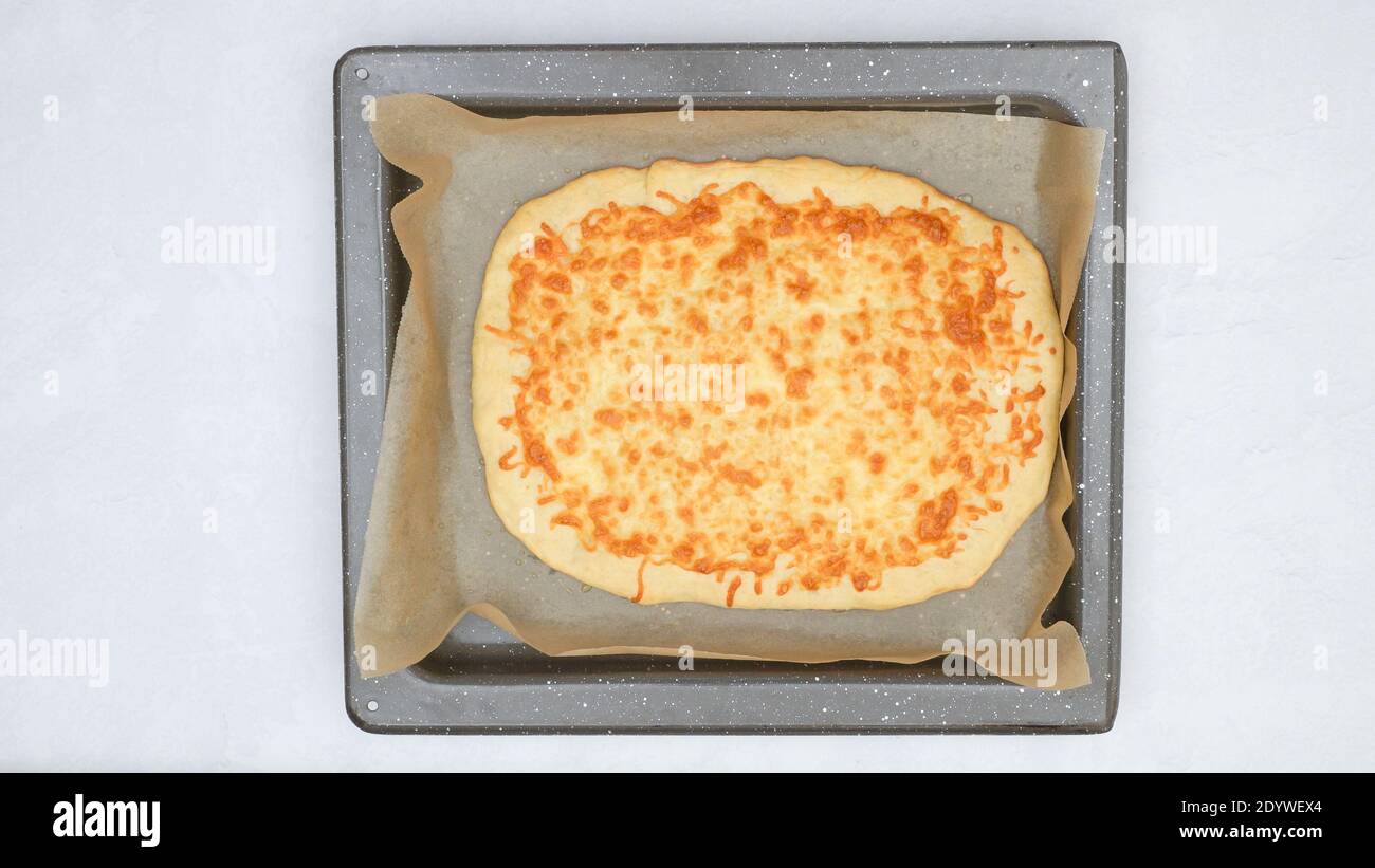 Fresh baked flat bread with mozzarella cheese topping close up on ...