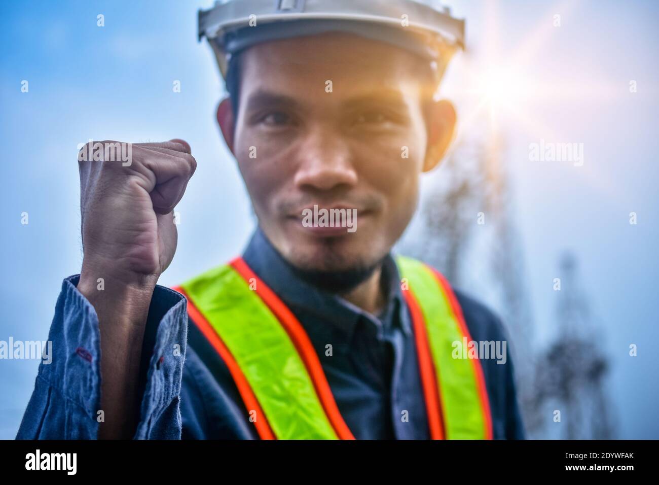 Engineer holding hand success at work Stock Photo - Alamy