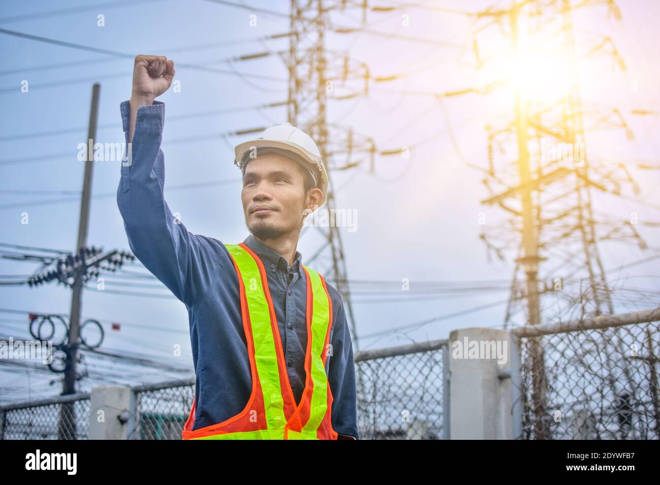 Engineer holding hand success at work Stock Photo - Alamy